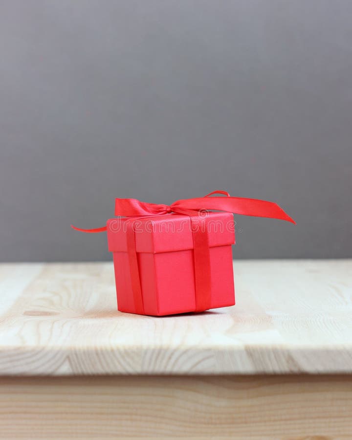 Red Box with Ribbon Bow on Wooden Table, Selective Focus Stock Photo ...