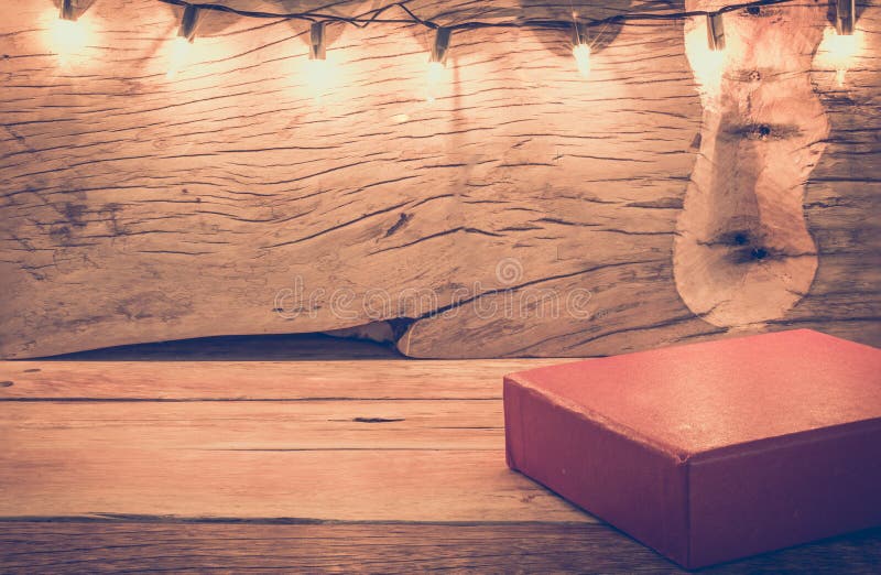 Red Box on a Wooden Table and Old Light Bulbs To Decorate. Stock Photo ...