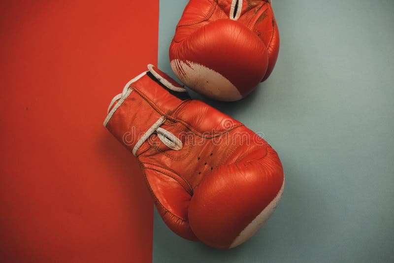 Red Boxing Gloves on a Red and Blue Background Stock Photo - Image of ...