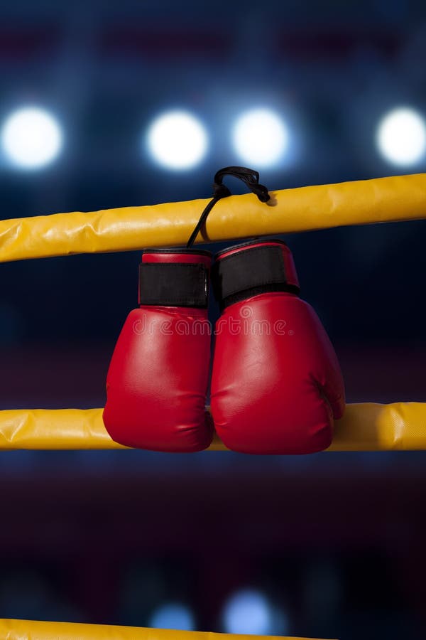 Red Boxing Gloves Hangs Off the Boxing Ring Stock Photo - Image of ...