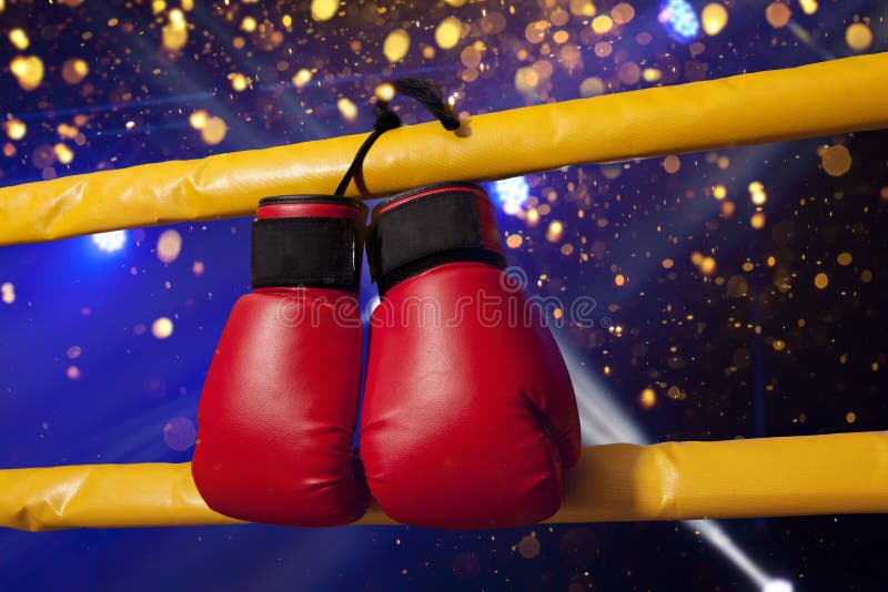 Red Boxing Gloves Hangs Off the Boxing Ring Stock Image - Image of ...