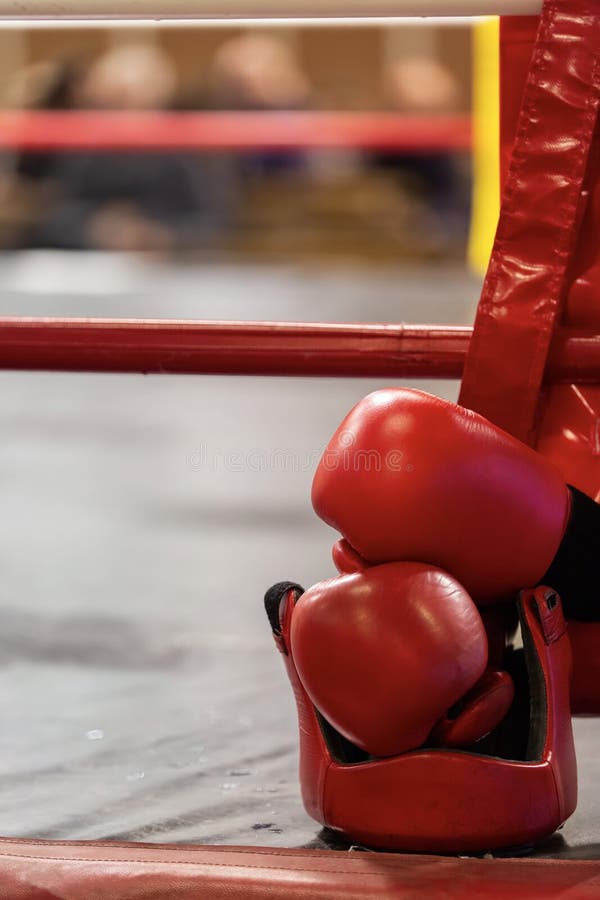Red Boxing Gloves on the Ring Floor in a Gym Stock Photo - Image of ...