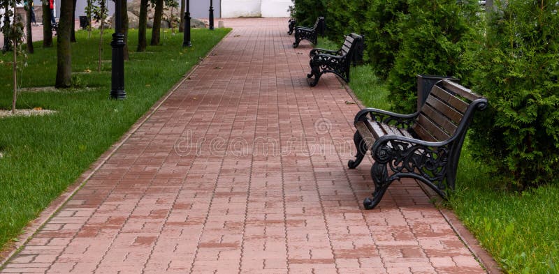 Red Brick Alley with Brown Benches. Autumn Stock Photo - Image of ...