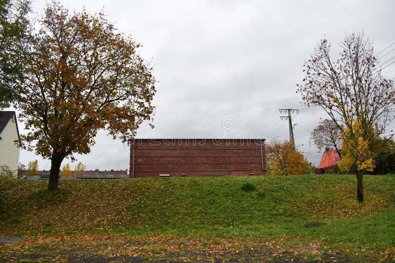 Red Brick Building Behind a Dam Wall Stock Image - Image of ...