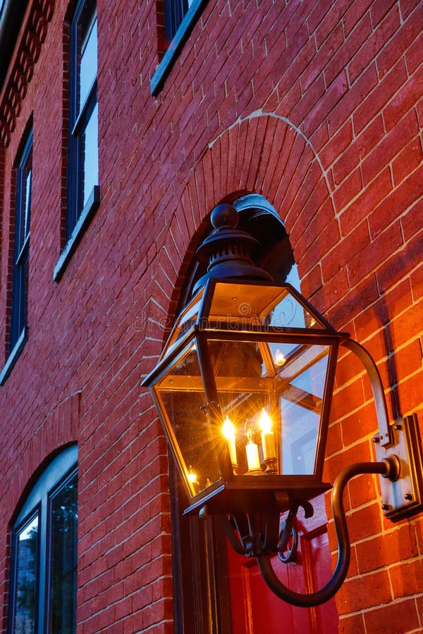 Red Brick Building Facade with Light in Forground Stock Image - Image ...