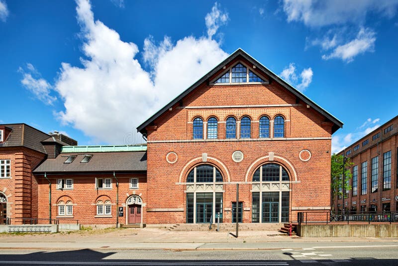 A Red Brick Building with Round Windows Editorial Photography - Image ...