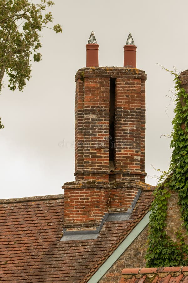 Vintage Red Brick Chimney Double Stack on English Tiled Rooftop Stock ...
