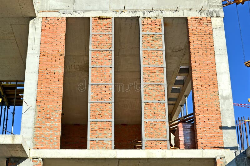 Red Brick Column Wall in Sunny Day, Building Site Diversity, Stock ...