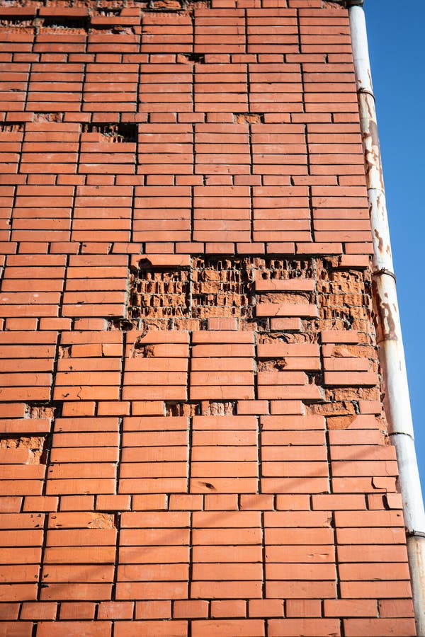 Red Brick Facade. Water Drain Pipe and Water Damage Stock Photo - Image ...