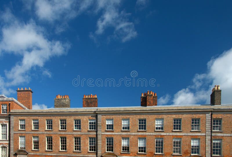 Red Brick Irish Building with Row of Chimney Stock Image - Image of ...