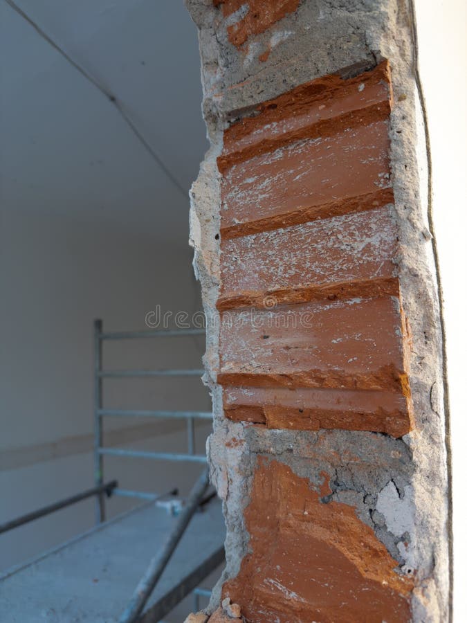 Red Brick Masonry Wall Section with Scaffolding in the Background Stock ...