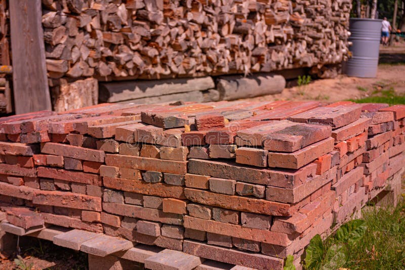 Red Brick Packed in Stack are Stored on Ground Outdoors at a Hardware ...
