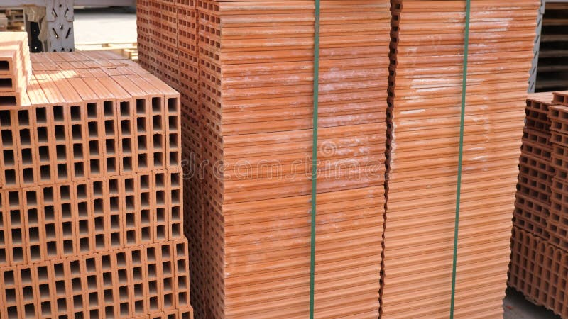 Pallets with Stack of Redbricks Lying at Warehouse of Building ...