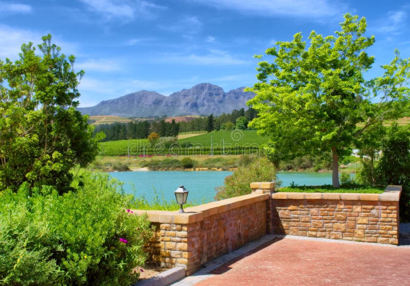Red Brick Square, Pond and Blueish Misty Mountains Stock Photo - Image ...