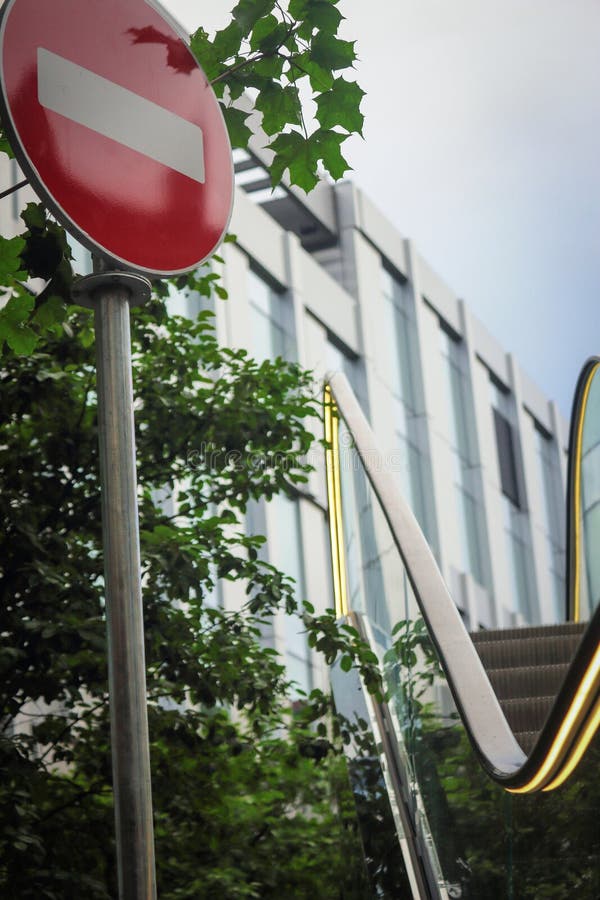 Red Brick Stop Road Sign Near Escalator Stock Photo - Image of moving ...