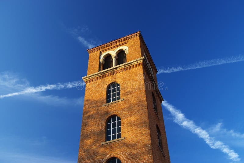 Red Brick Tower on a Field of Blue Sky Stock Image - Image of ...