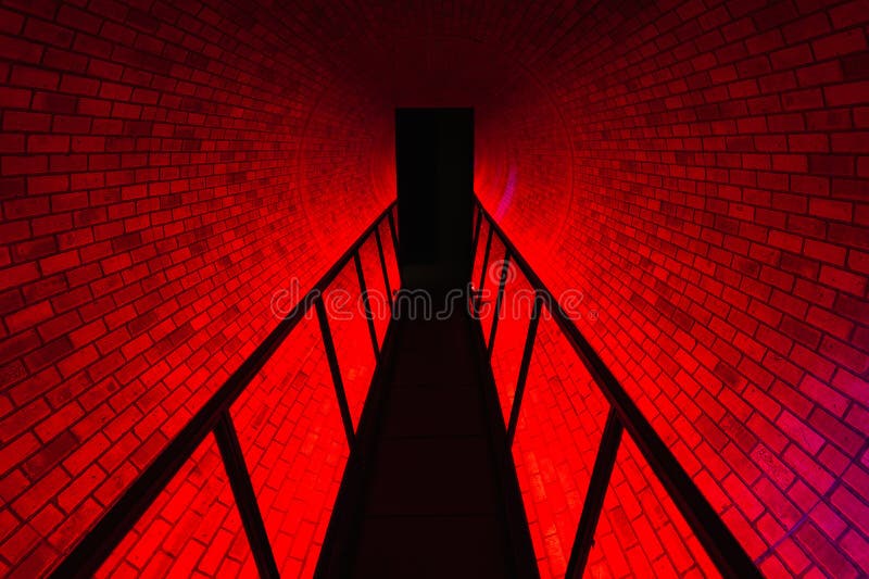 Red Brick Tunnel with a Symmetrical Corridor Leading into Darkness ...