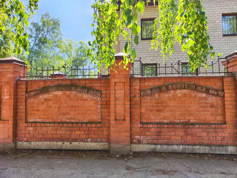 Red Brick Wall with Arch Detail in Urban Setting. Red Brick Wall ...