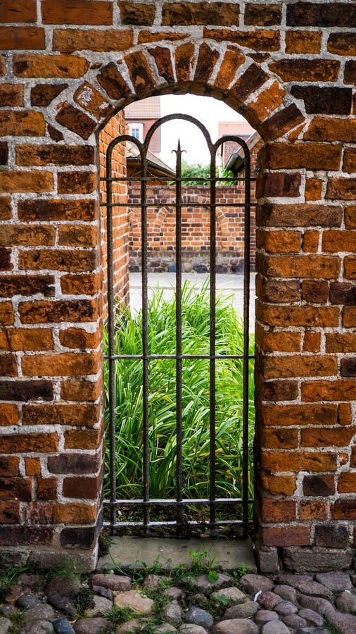 Old red brick wall barred stock photo. Image of macro - 317001144