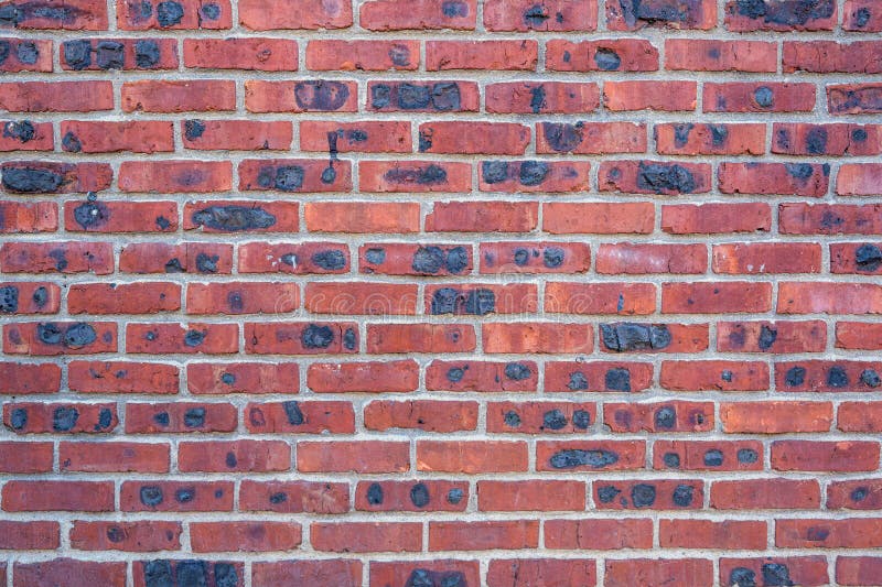 Red Brick Wall with Burnt Black Spots Stock Photo - Image of cement ...