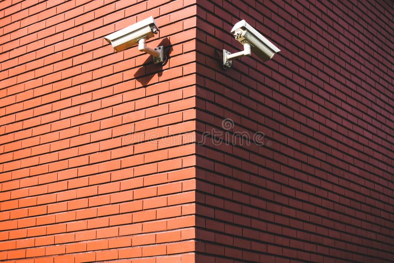 Red Brick Wall Corner with Video Cameras Security System Stock Image ...
