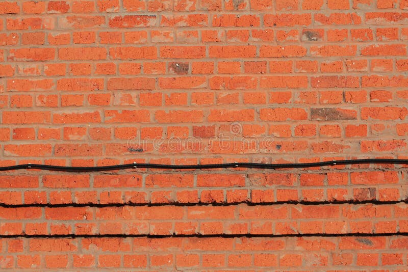 Red Brick Wall with Corrugated Pipe for Electrical Wiring Stock Image ...