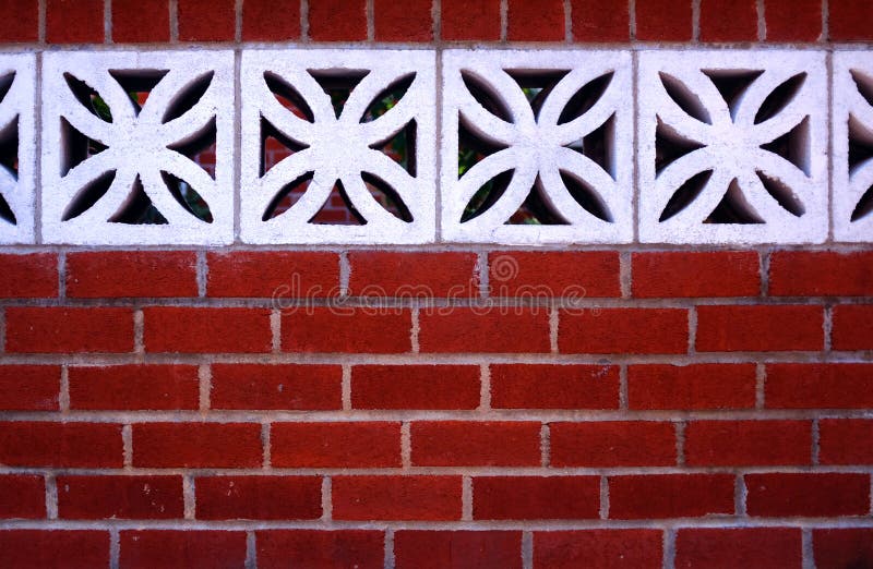 Red Brick Wall with Floral Concrete Blocks Close Up Stock Image - Image ...