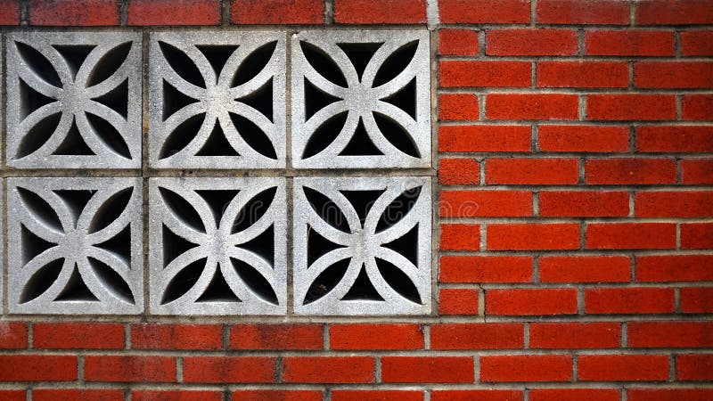 Red Brick Wall with Floral Patterned Concrete Blocks Close Up Stock ...