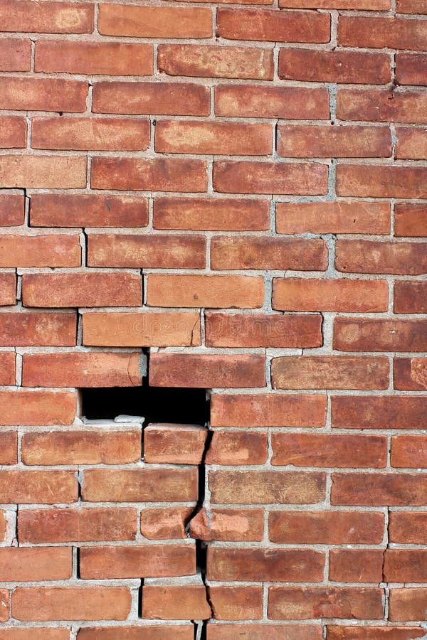 Vertical Image of Red Brick Wall with Cracks and Missing Pieces Stock ...