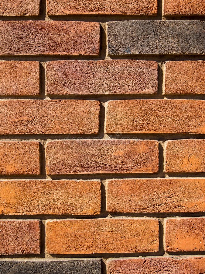 A Red Brick Wall, Rectangular Shaped Bricks with a Rough Texture ...