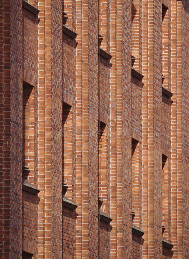 Red Brick Wall with Row of Narrow Windows Stock Image - Image of ...