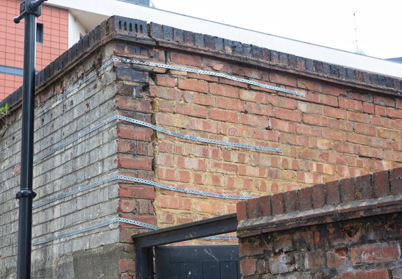 Red Brick Wall with Simple Reparations Stock Photo - Image of repair ...