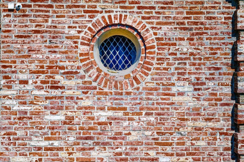 Fragment of an Old Red Brick Wall with a Round Window Close-up Stock ...