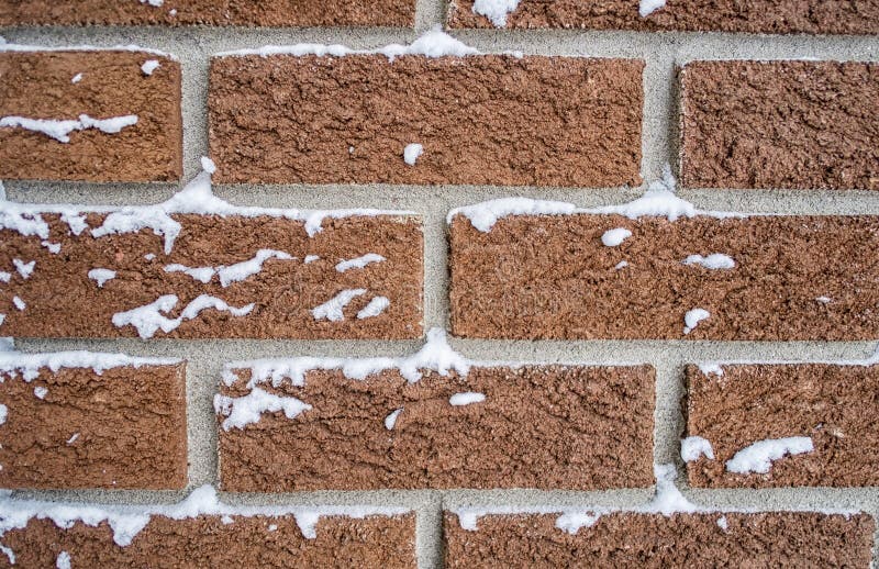 Red brick wall with snow stock photo. Image of frame - 107906244