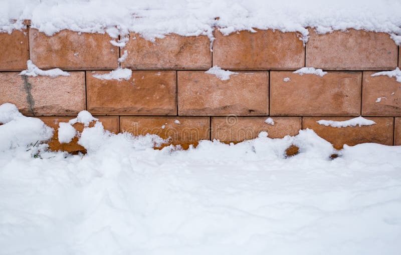 Red Brick Wall Under Snow in Winter. Background Stock Photo - Image of ...