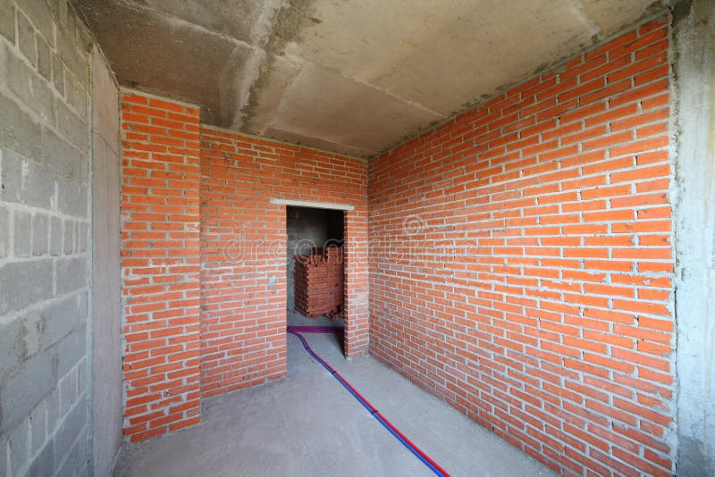 Red Brick Walls in Room of Building Under Construction Stock Photo ...