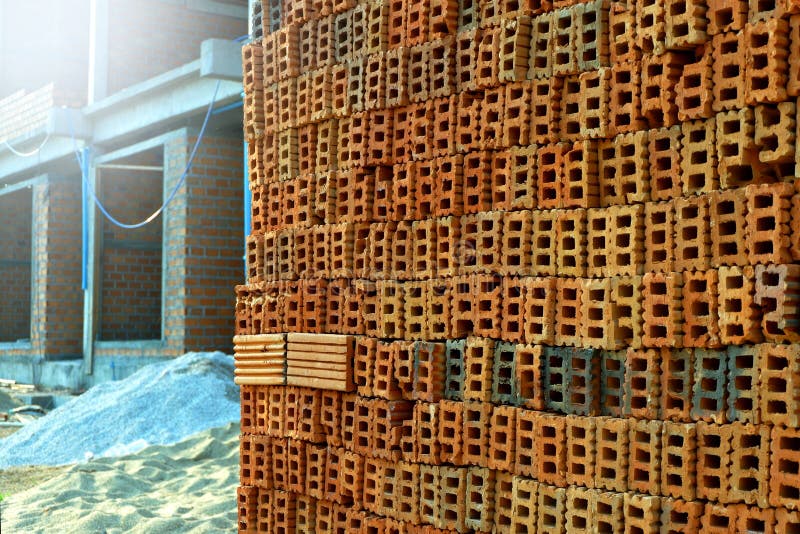 Red Bricks for Building in Construction Site. Stock Photo - Image of ...
