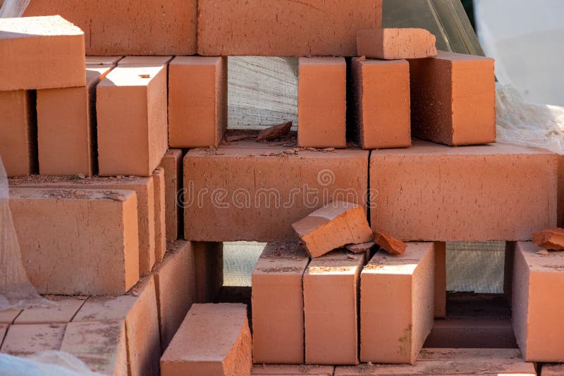 Red Bricks in a Construction Warehouse on the Street. Building Material ...