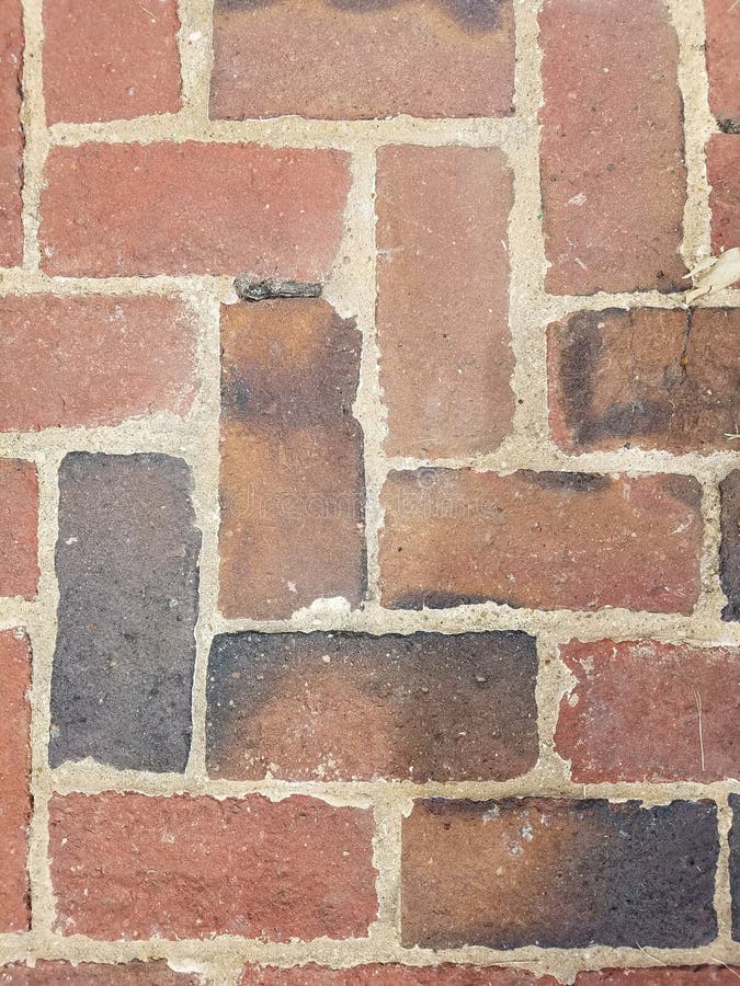 Red Bricks and One Dark Colored Brick Stock Image - Image of wall, tile ...