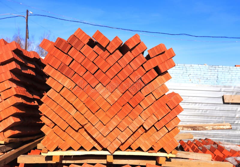 Red bricks on a pallet stock image. Image of layer, construction - 68130225