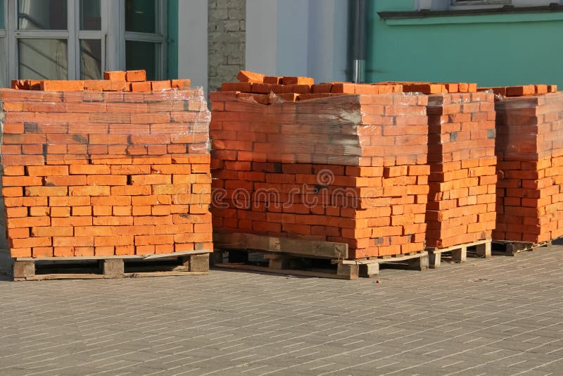 Pallets with red bricks stock image. Image of materials - 121153483