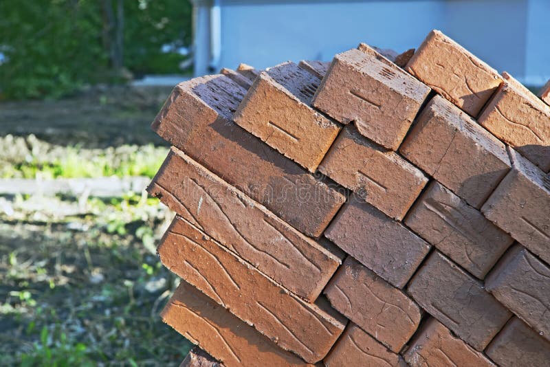 Red bricks pile stack. stock photo. Image of industrial - 113185536