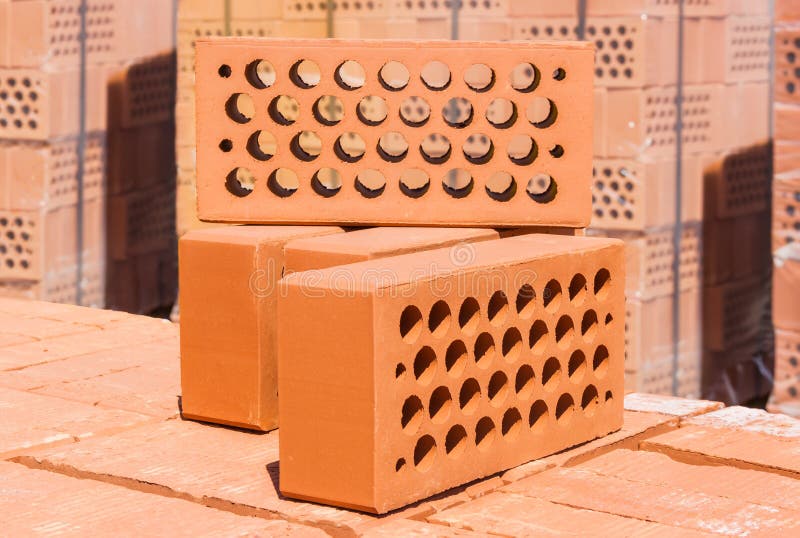 Several Perforated Bricks of Different Colors with Round Holes Stock ...