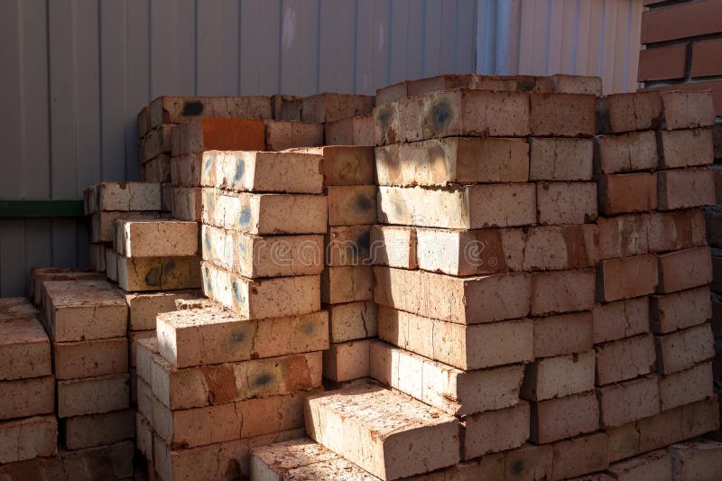 Red Bricks Stacked on a Construction Site Close-up. Building Stone ...