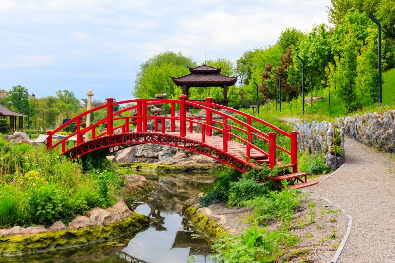 Red Bridge and Gazebo by Pond in Japanese Garden Stock Image - Image of ...