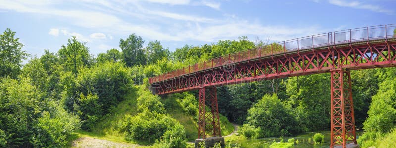 Red Bridge in Green Nature with a River Stream Stock Photo - Image of ...