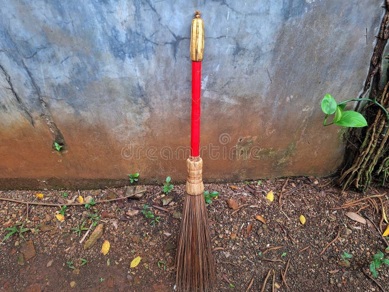 Red broom in the yard stock photo. Image of redbroomstick - 374425986