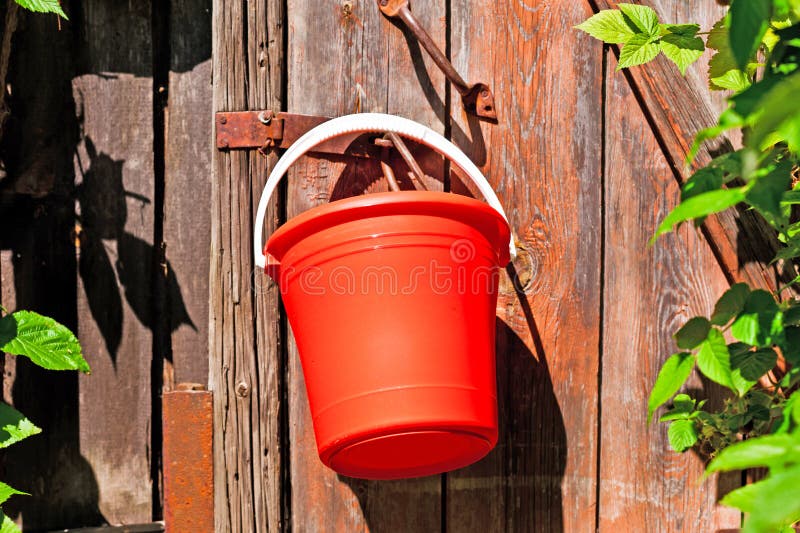 Red bucket stock photo. Image of bright, bolt, vegetation - 25639796