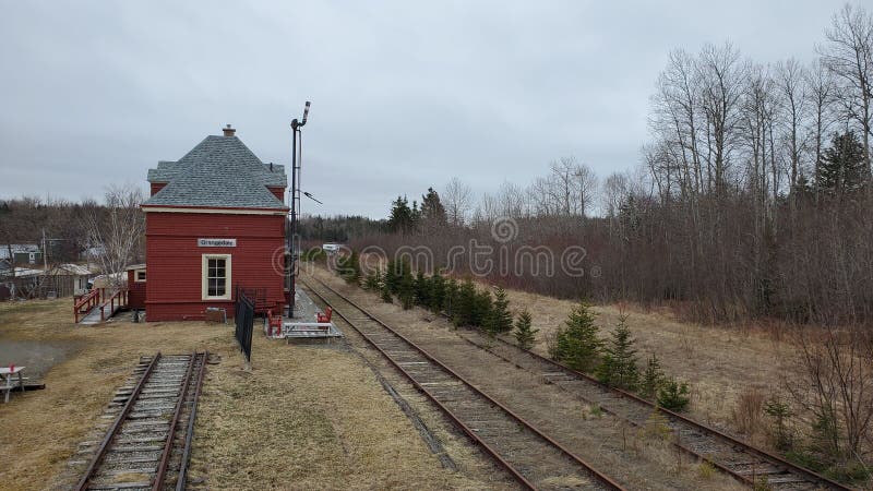 Red Building Next To a Train Track Stock Image - Image of railway ...