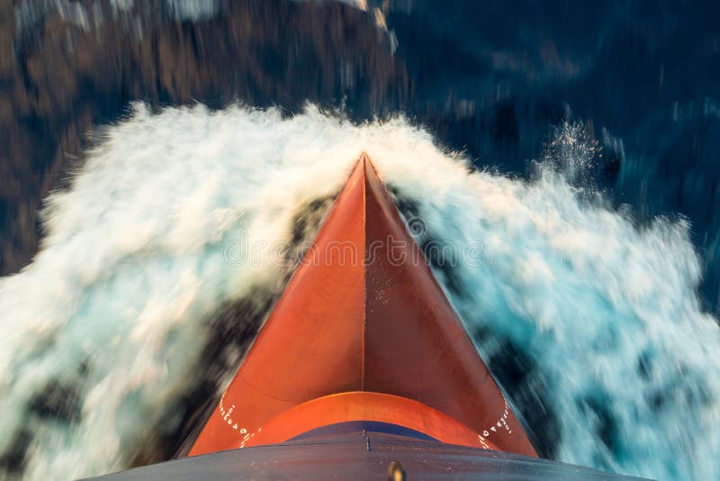 Red Bulb of the Bow of a Oil Tanker is Underway at Sea while it Sunset ...